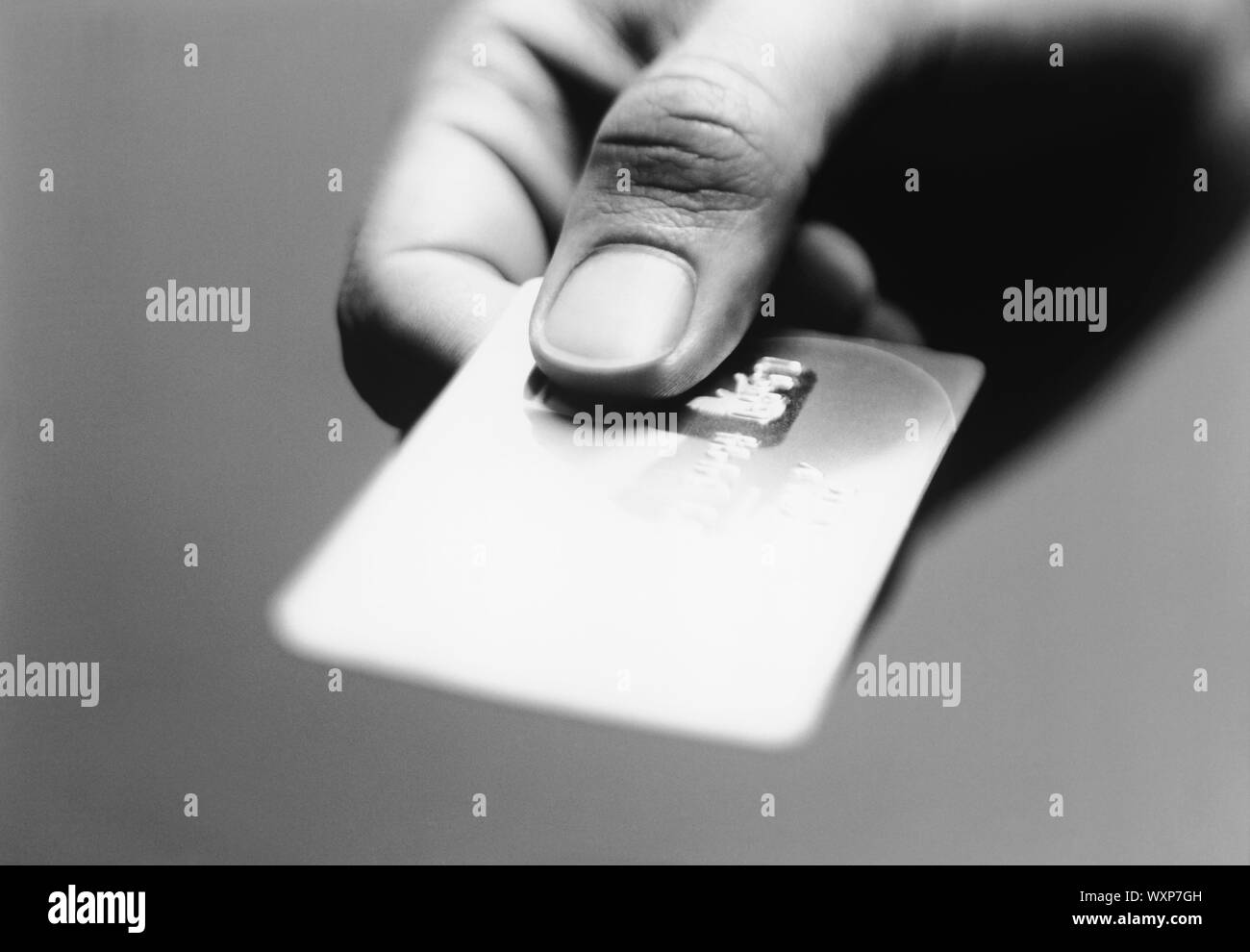 Atm card hand Black and White Stock Photos & Images - Alamy