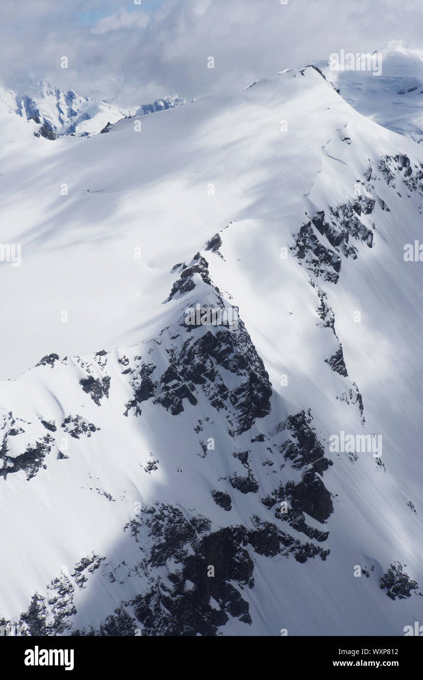 Mountain peaks beneath snow Stock Photo - Alamy