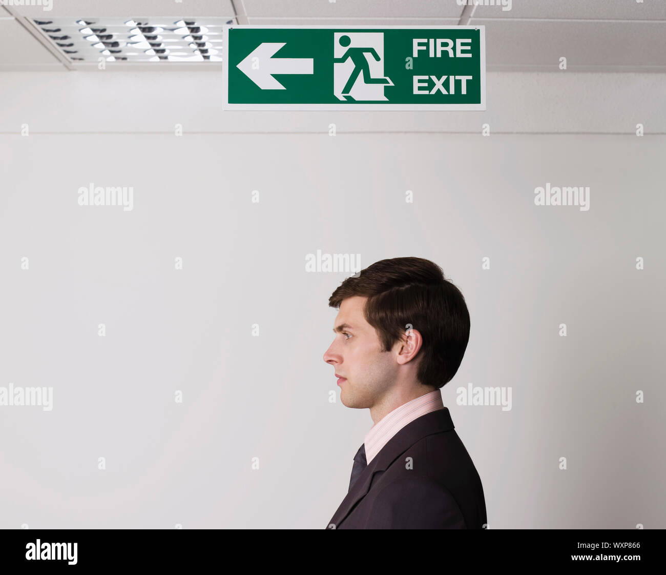 Standing under exit sign hi-res stock photography and images - Alamy