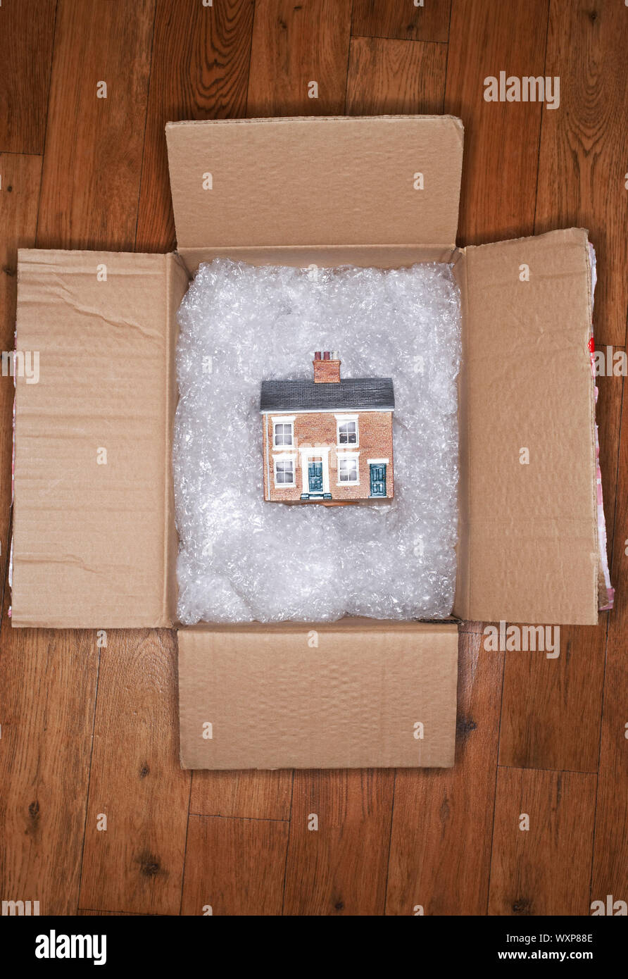 New Home in Moving Box Stock Photo - Alamy