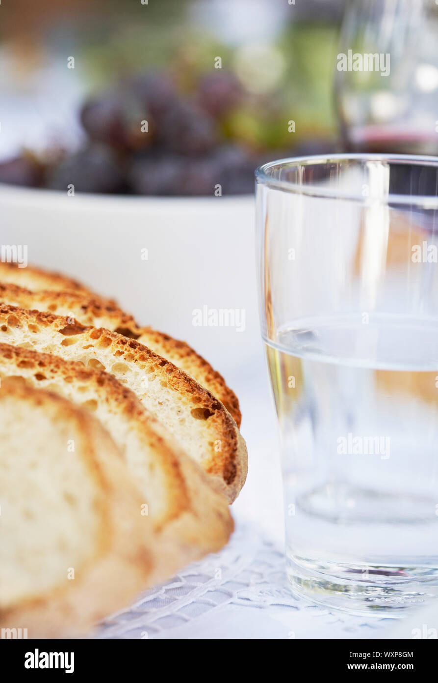 Loaf of Bread and Glass of Water Stock Photo - Alamy