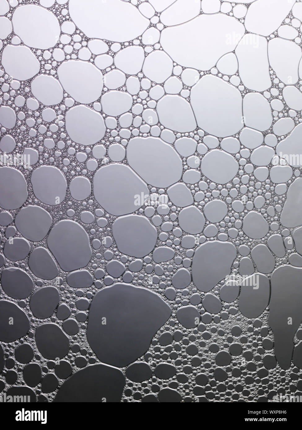 Bubbles of water on grey surface Stock Photo - Alamy