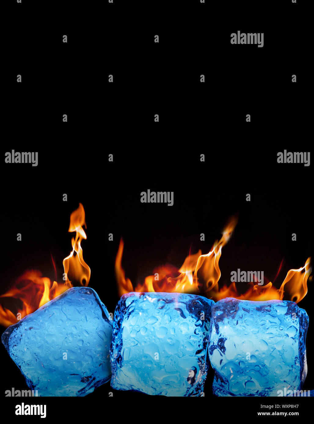Burning ice cubes on black background Stock Photo - Alamy