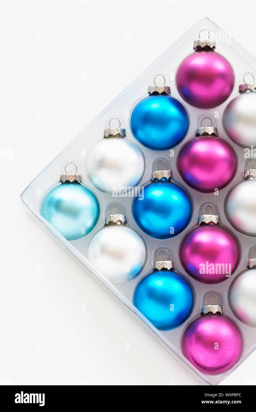 Christmas baubles in tray on white background Stock Photo - Alamy