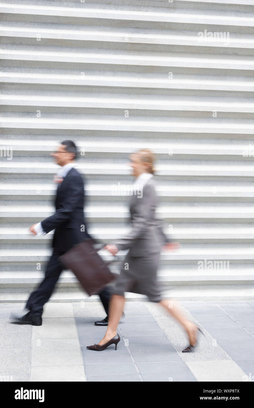 Businesspeople Walking Fast Stock Photo - Alamy