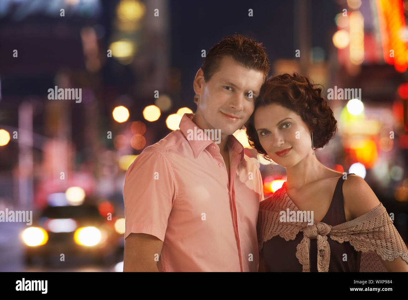 Couple in the City at Night Stock Photo - Alamy