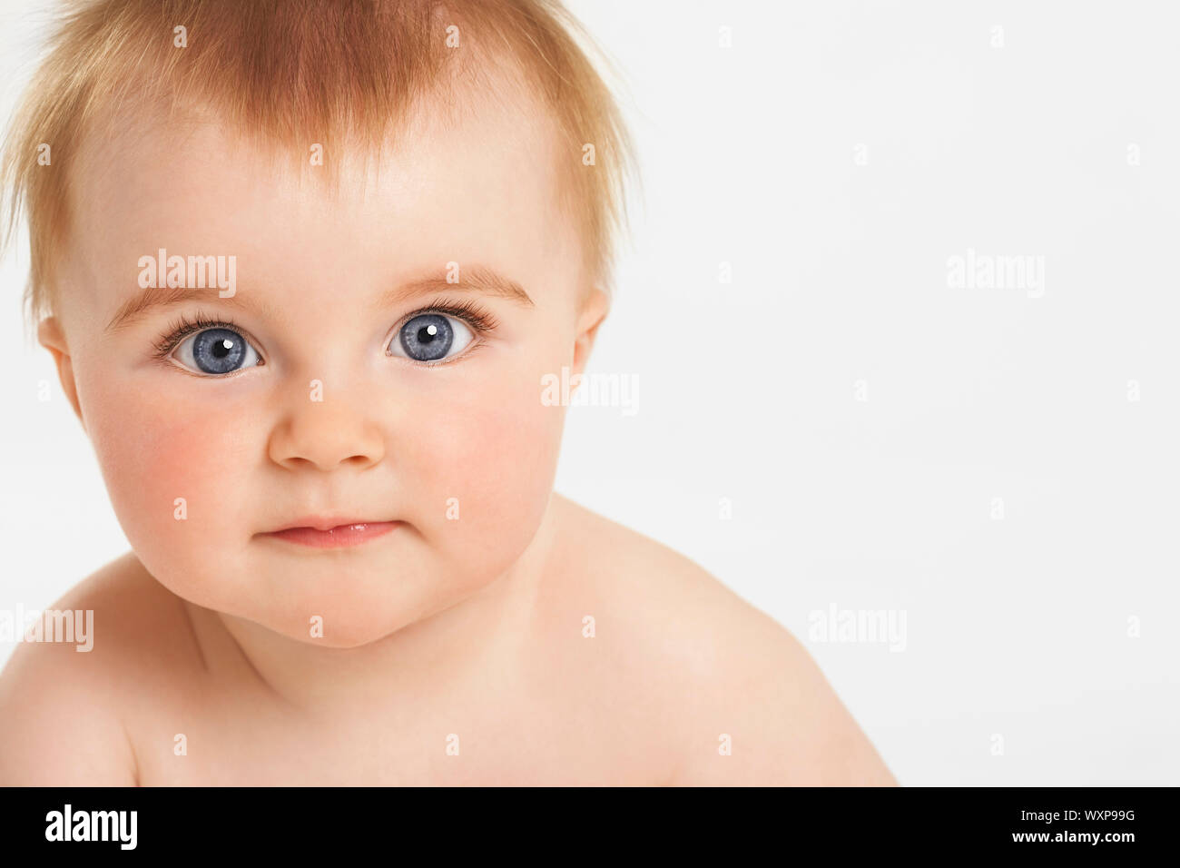 Closeup portrait of cute baby with ginger hair isolated on white ...