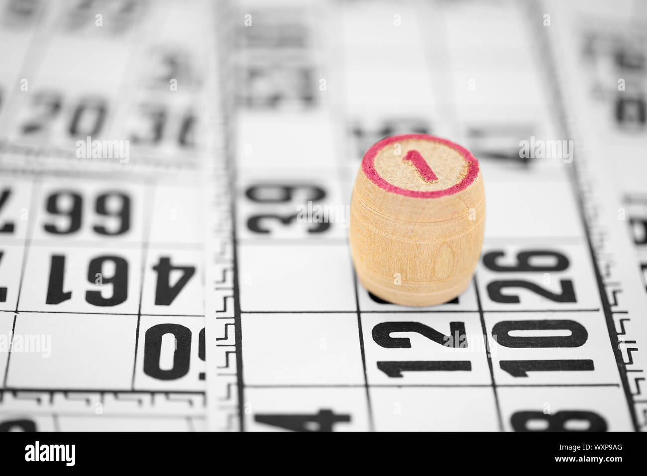 Counter number one bingo against game cards Stock Photo - Alamy