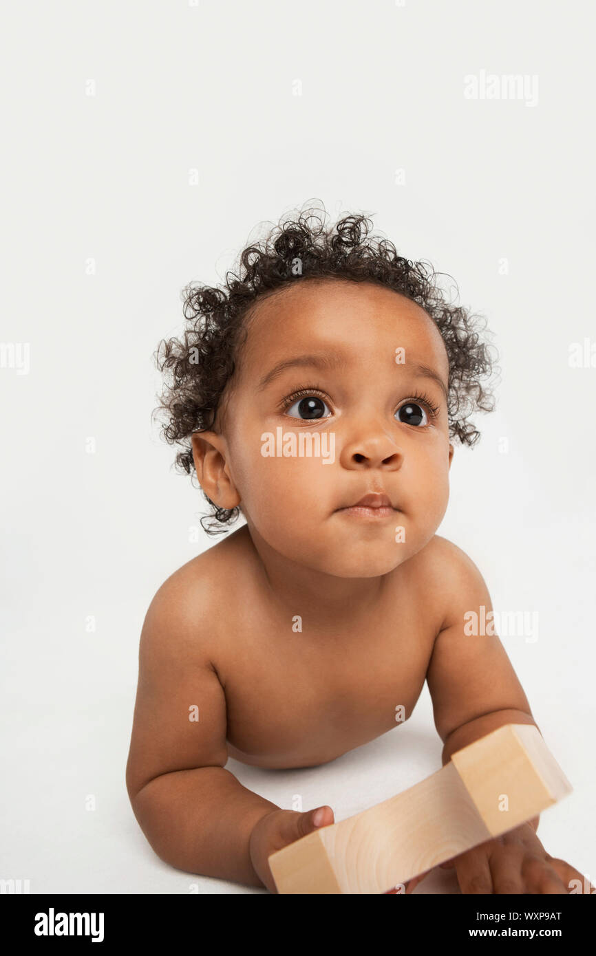 Cute baby holding building block isolated on white background Stock ...