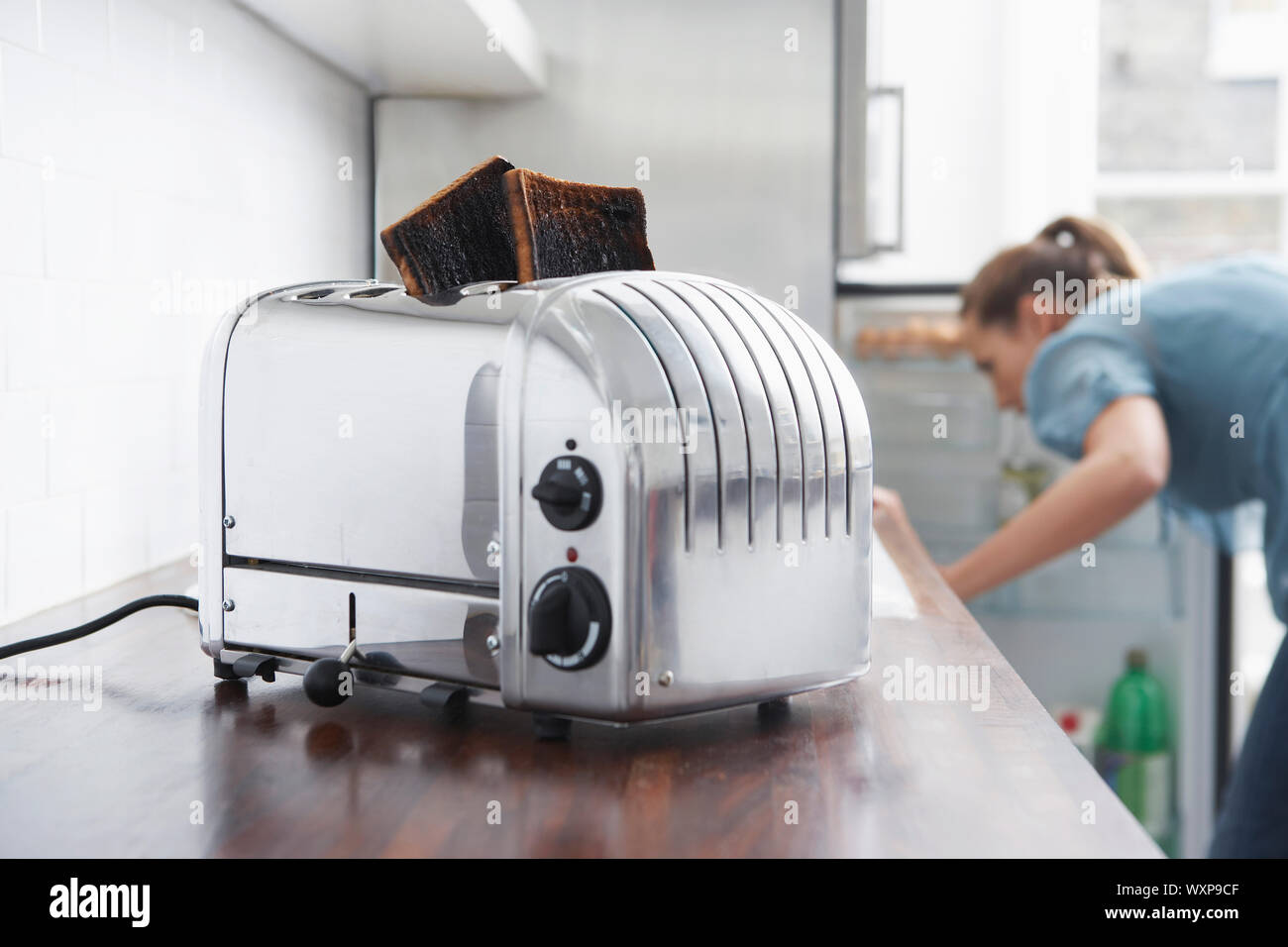 Burned toasts in toaster hi-res stock photography and images - Alamy