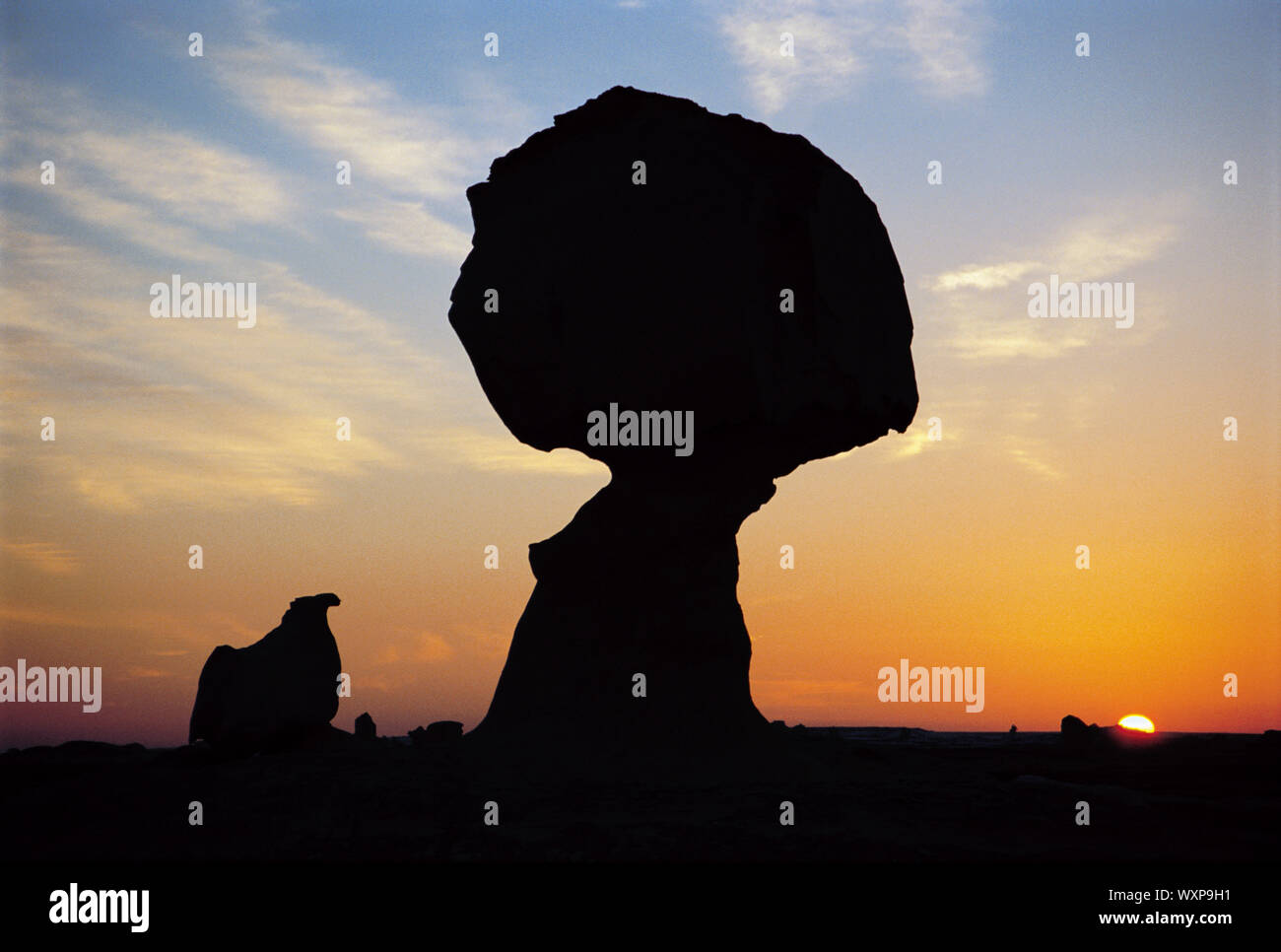 Silhouette of rock at sunset Stock Photo - Alamy