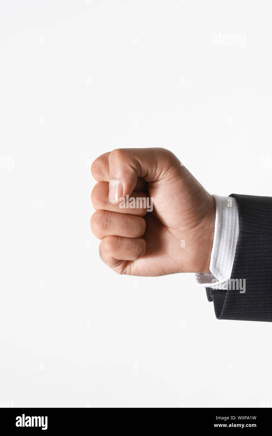 Closeup of hand with clenched fist against white background Stock Photo ...
