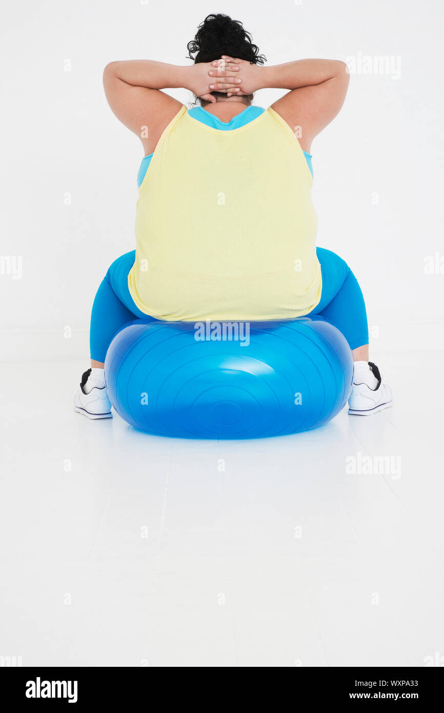 Rear view overweight woman sitting hi-res stock photography and images ...