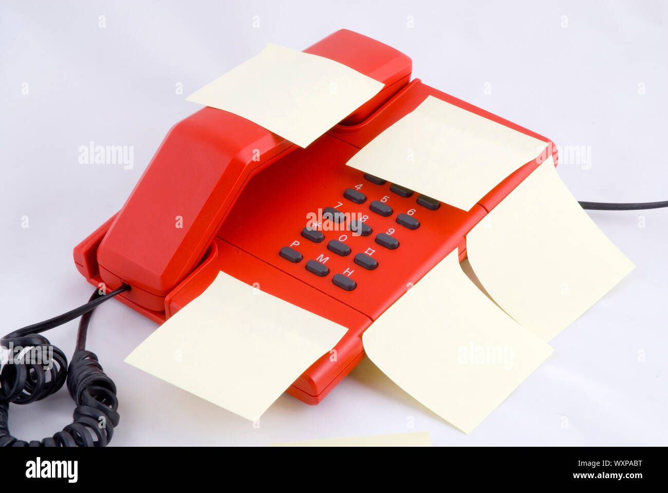 red telephone with yellow memo paper Stock Photo - Alamy