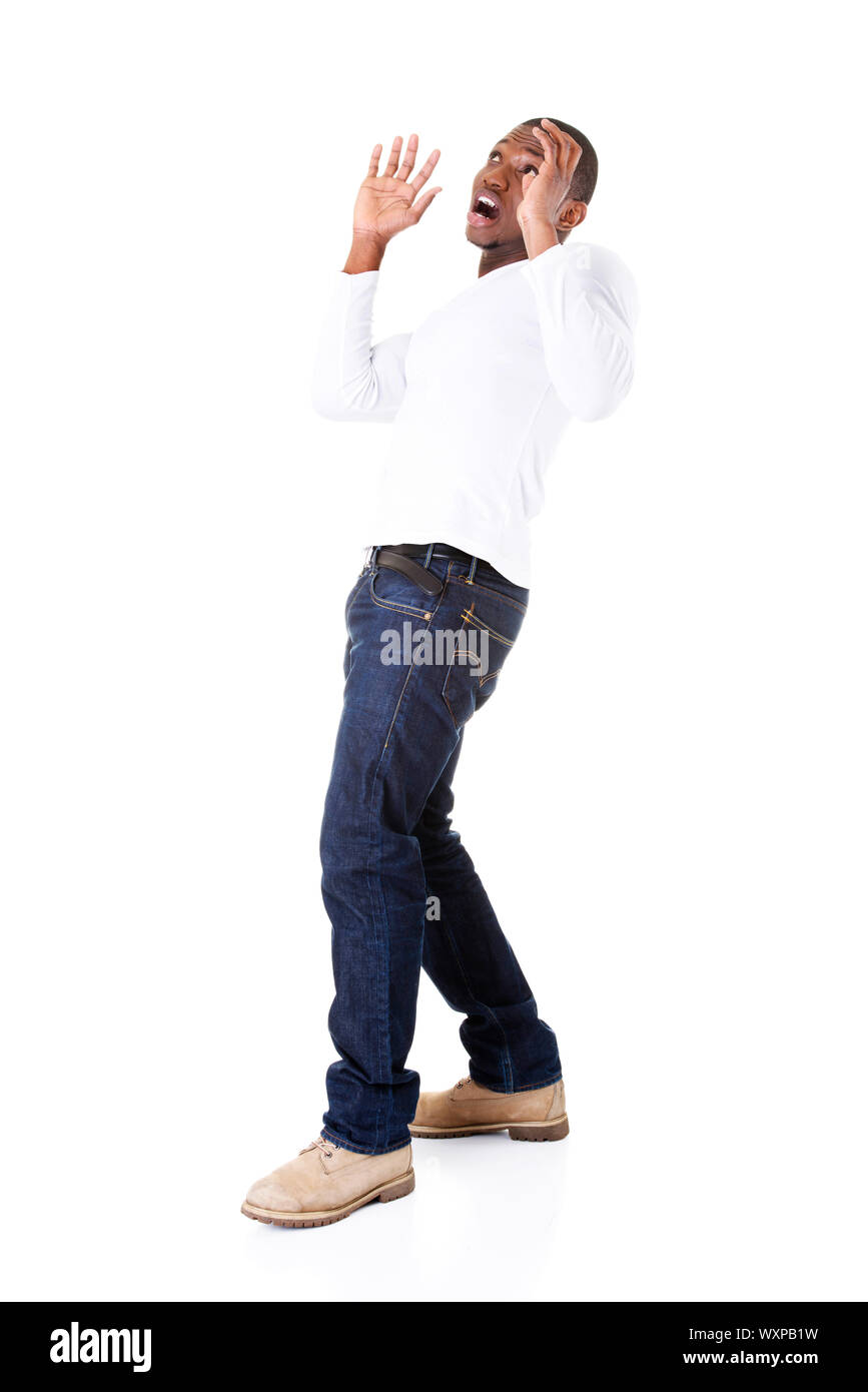 Handsome young man standing, scared. Isolated on white Stock Photo - Alamy
