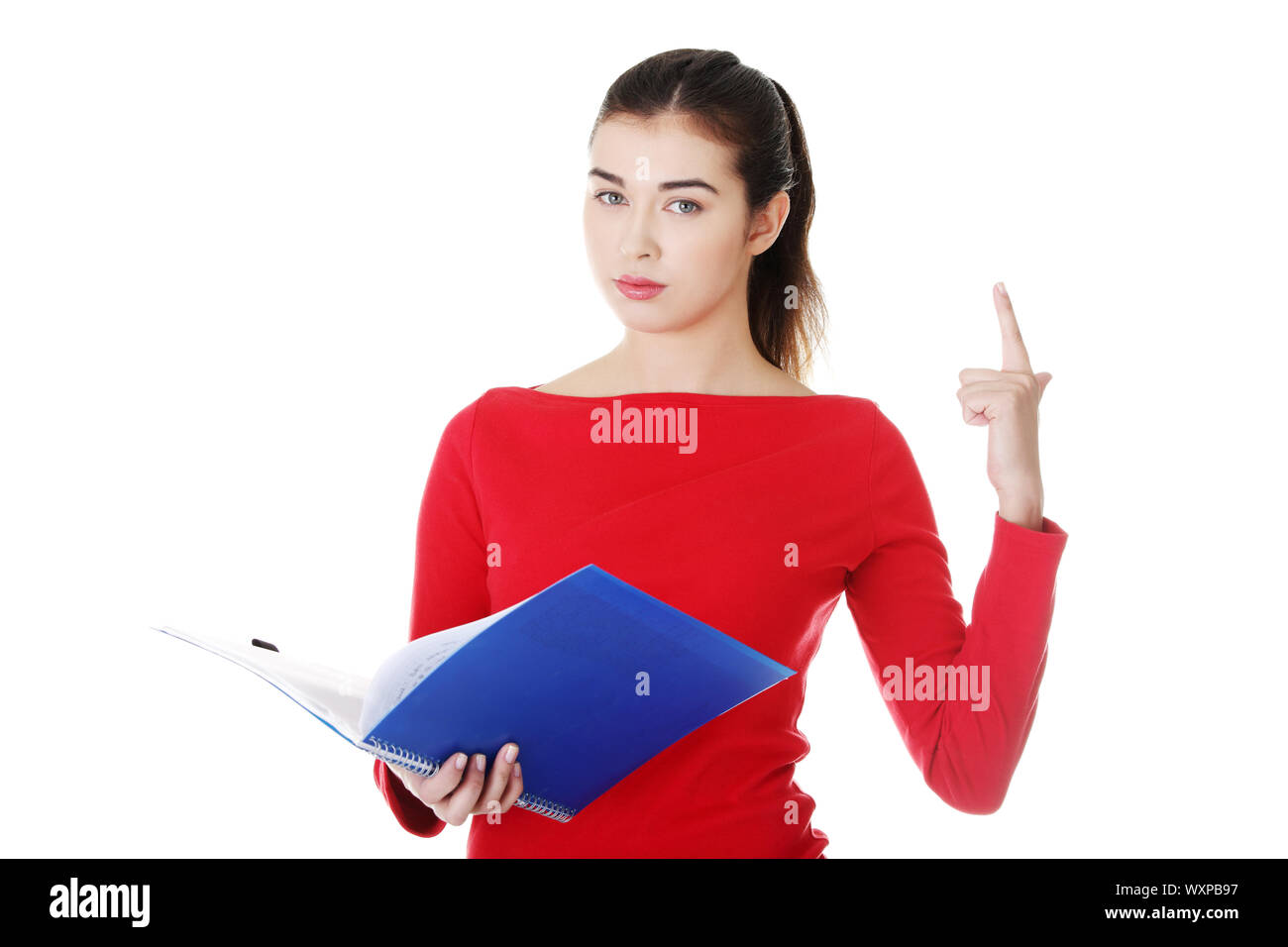Woman standing with files and pointing up. Vertical. Isolated on white ...