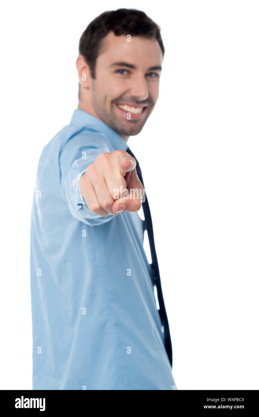 Cheerful businessperson pointing towards camera Stock Photo - Alamy