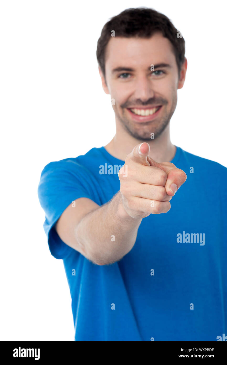 Casual cheerful guy pointing at camera Stock Photo - Alamy
