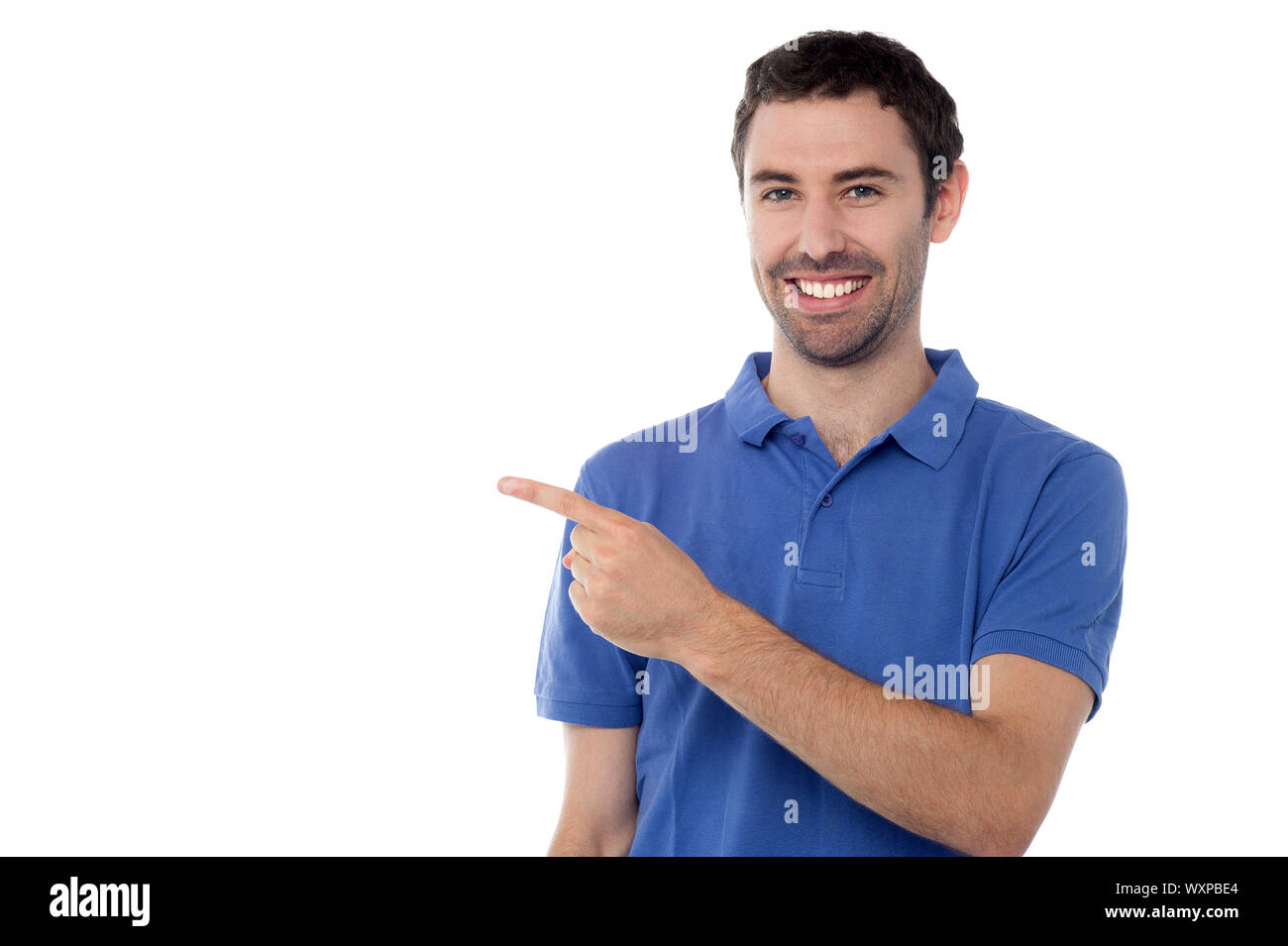 Guy facing camera, pointing away Stock Photo - Alamy