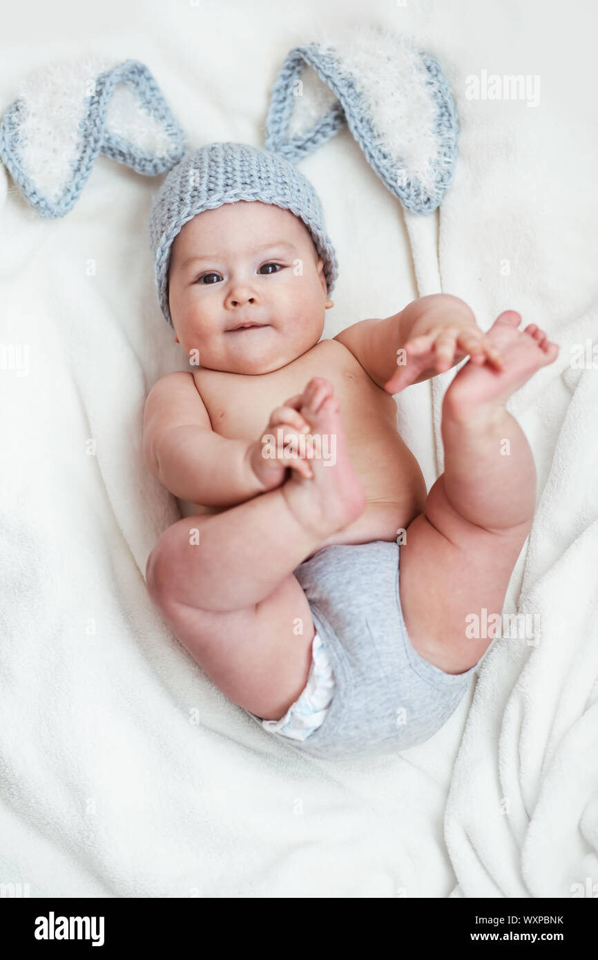 Portrait of a cute 6 months baby wearing rabbit hat Stock Photo - Alamy