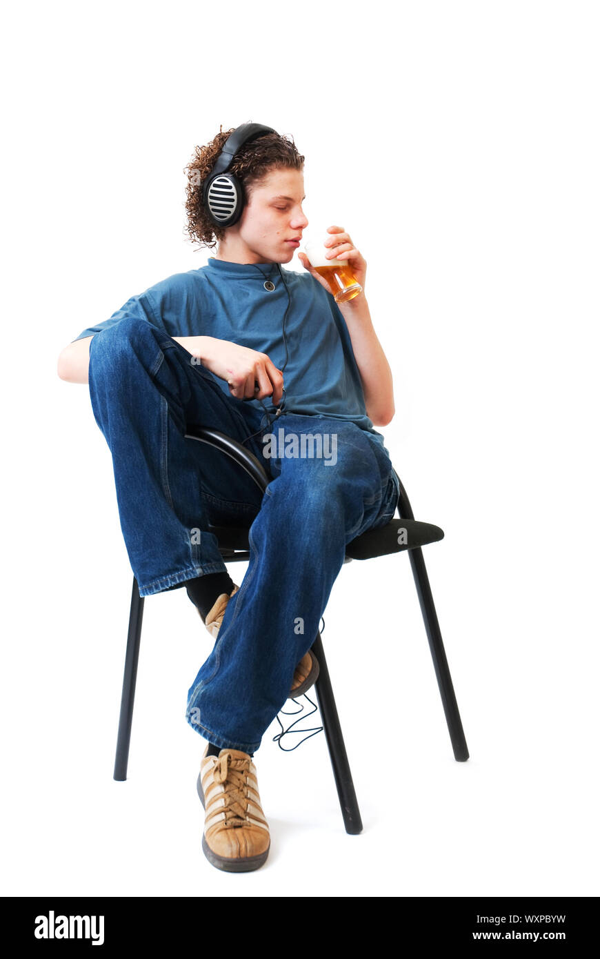 Young boy is listening to the music and drinking alcohol Stock Photo ...