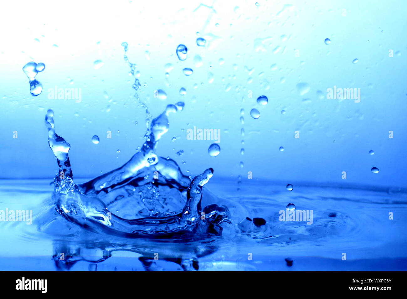 great blue water splash close up macro Stock Photo - Alamy