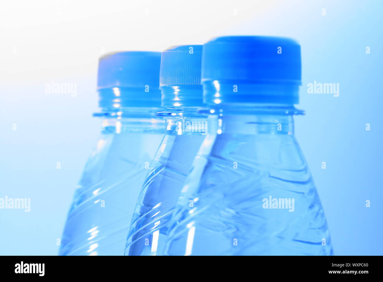 clear cold blue water in bottle Stock Photo - Alamy