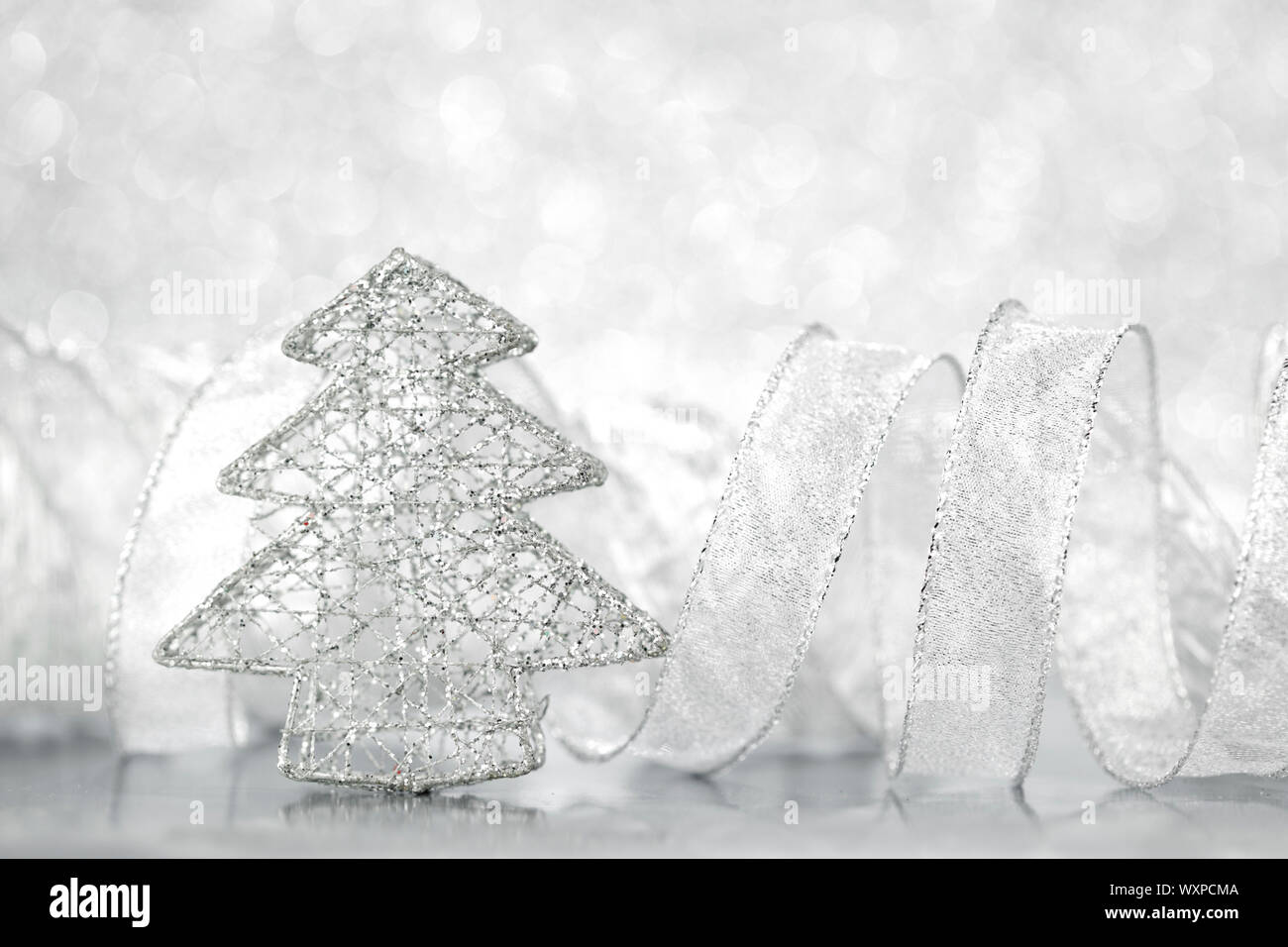 Christmas card with decoration on shiny silver background Stock Photo ...
