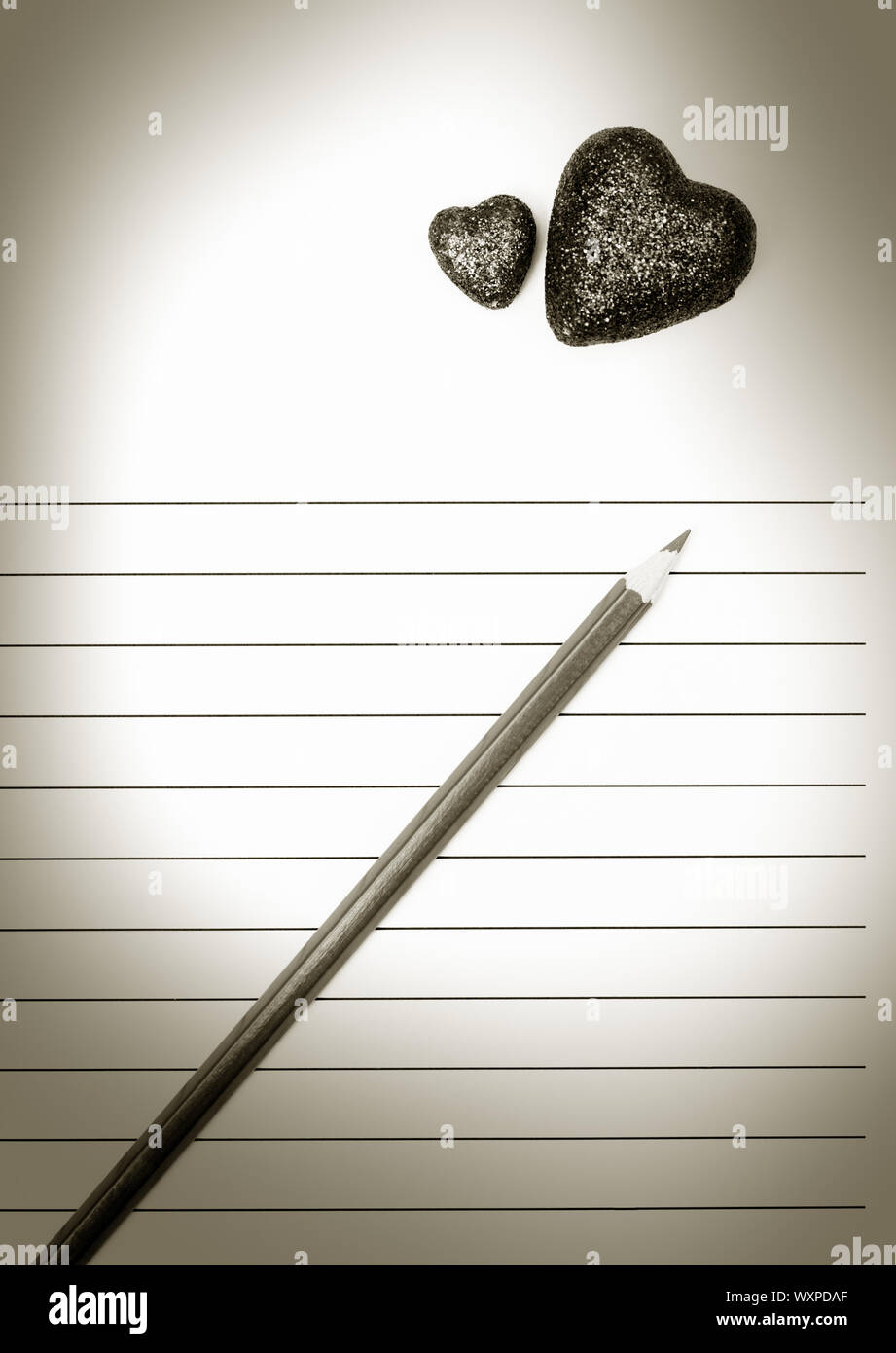 Pencil and two hearts on a blank love letter. Sepia colors added Stock ...