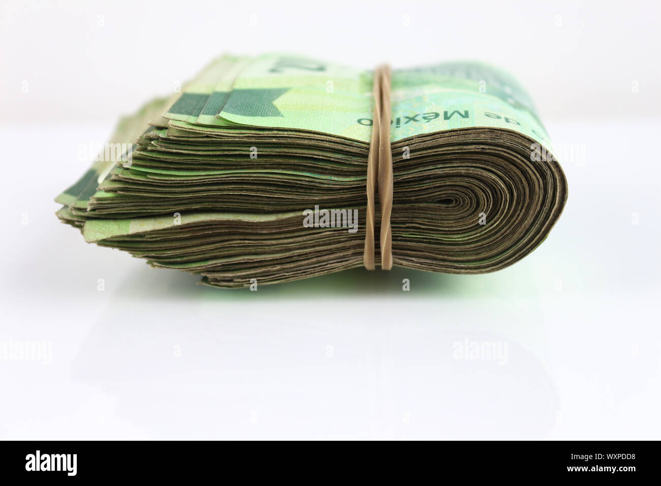 Big stack of Cash. Isolated on white background Stock Photo - Alamy