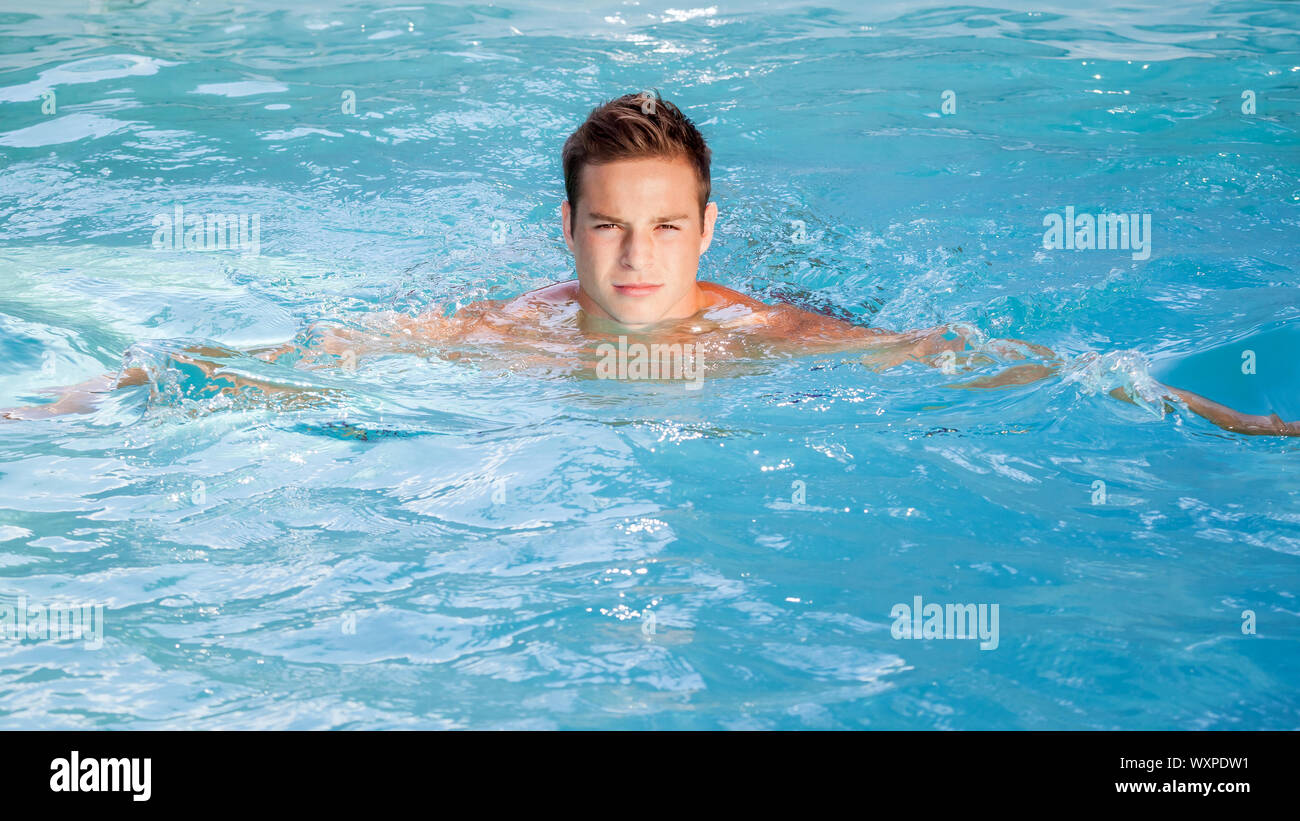 An image of a beautiful man swimming in the pool Stock Photo - Alamy