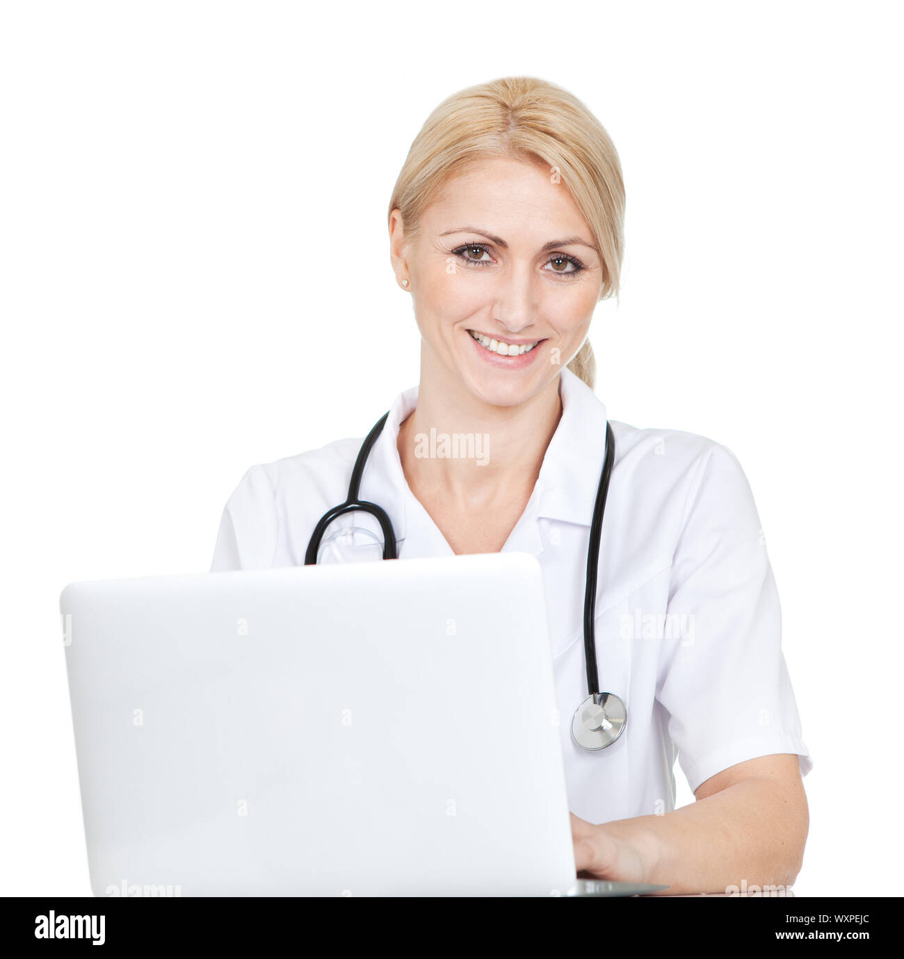 Medical doctor working on laptop. Isolated on white Stock Photo - Alamy