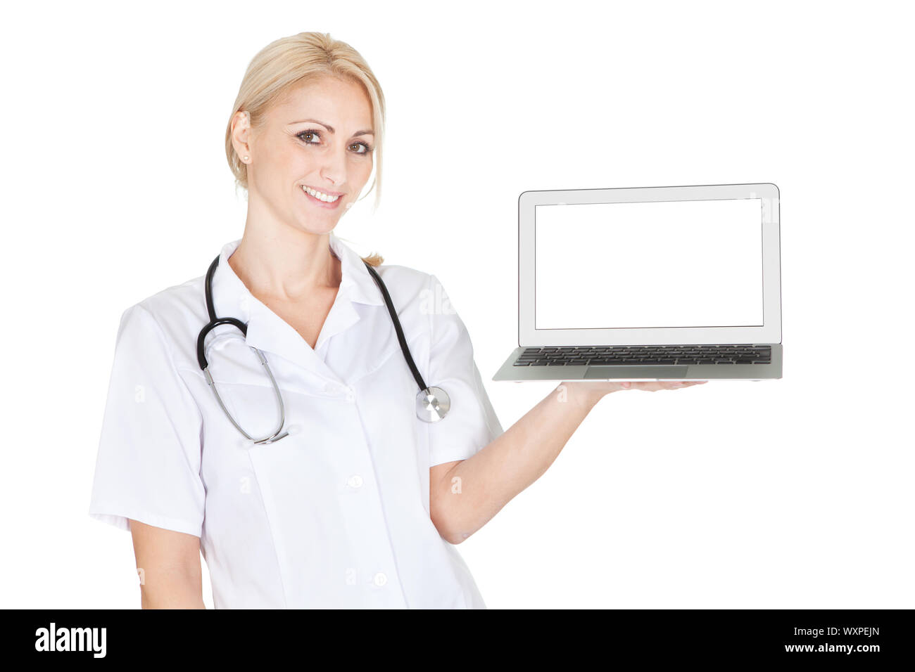 Smiling medical doctor woman presenting laptop. Isolated on white Stock ...