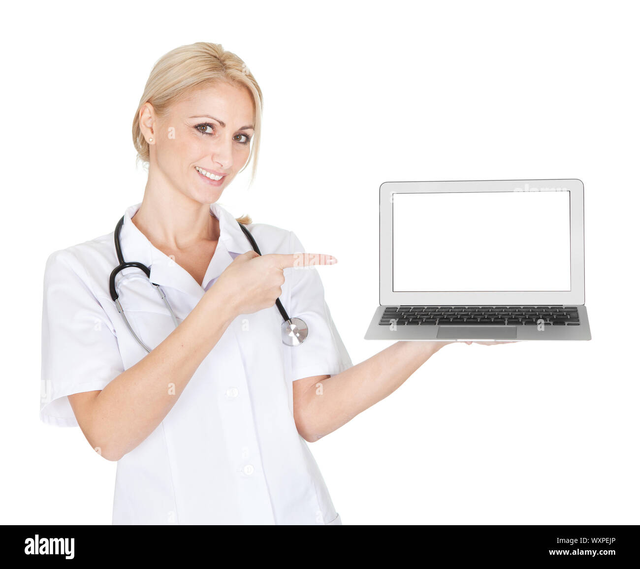 Smiling medical doctor woman presenting laptop. Isolated on white Stock ...