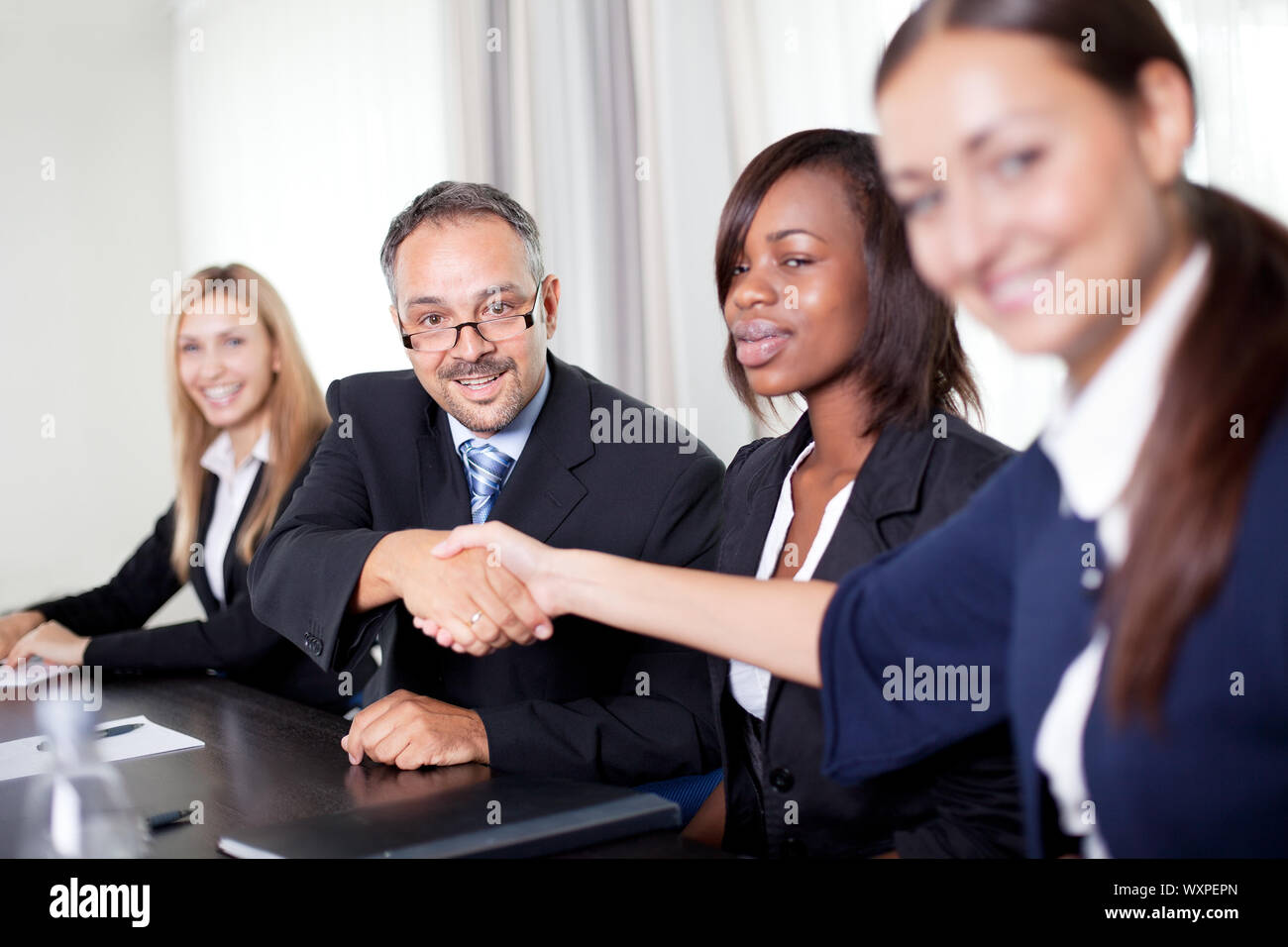 Image of business partners handshake on signing contract Stock Photo ...