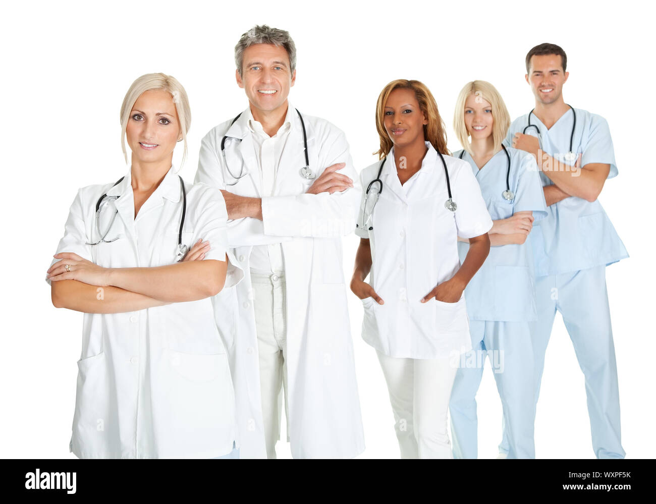 Team of doctors standing in line isolated on white background Stock ...