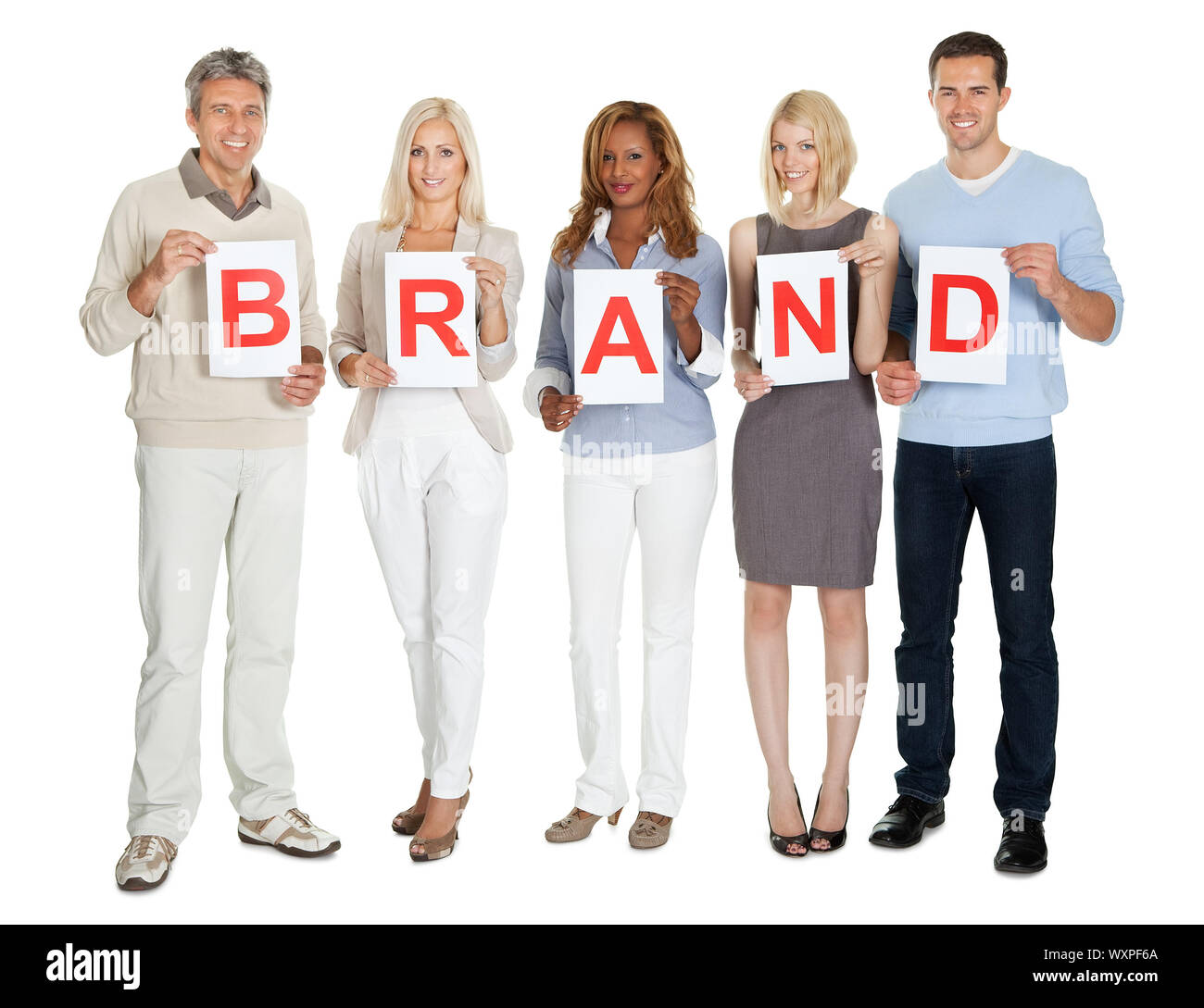 Casual group of people with a brand sign board Stock Photo - Alamy