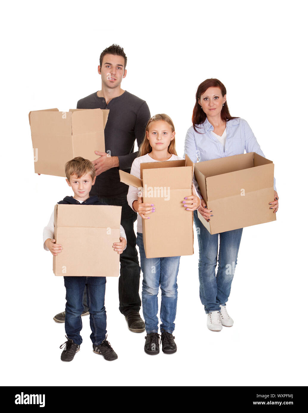 Happy young family carrying cardboard boxes. Isolated on white Stock ...