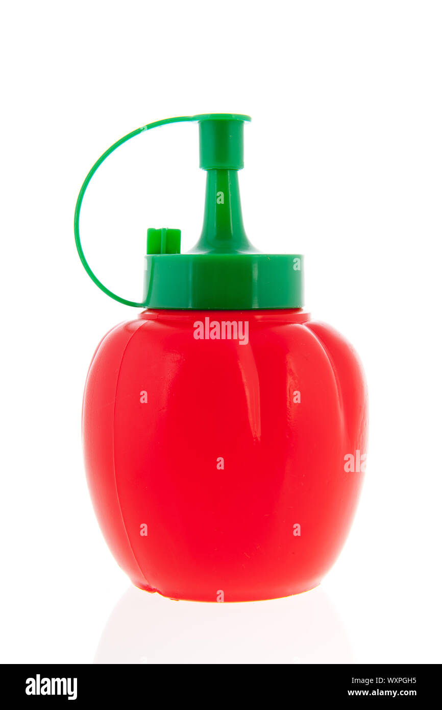 Plastic bottle ketchup in shape of tomato isolated over white ...