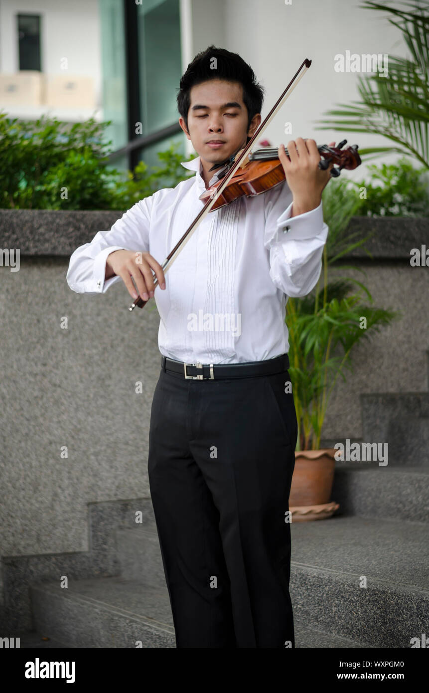Thailand asia man with his violin he is a soloist Stock Photo - Alamy
