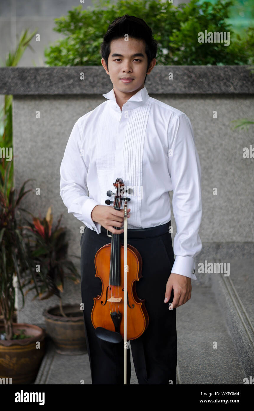 Thailand asia man with his violin he is a soloist Stock Photo - Alamy