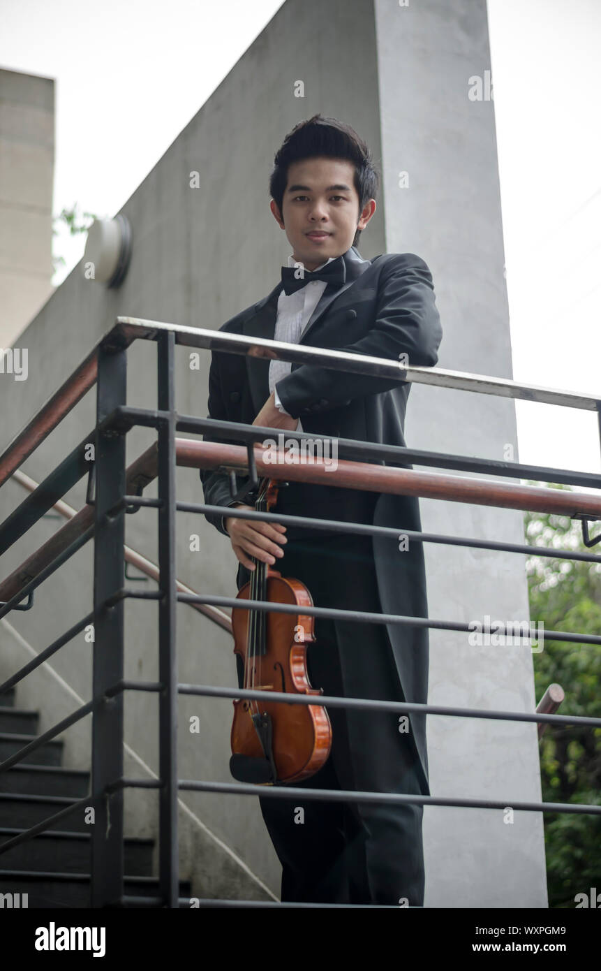Thailand asia man with his violin he is a soloist Stock Photo - Alamy