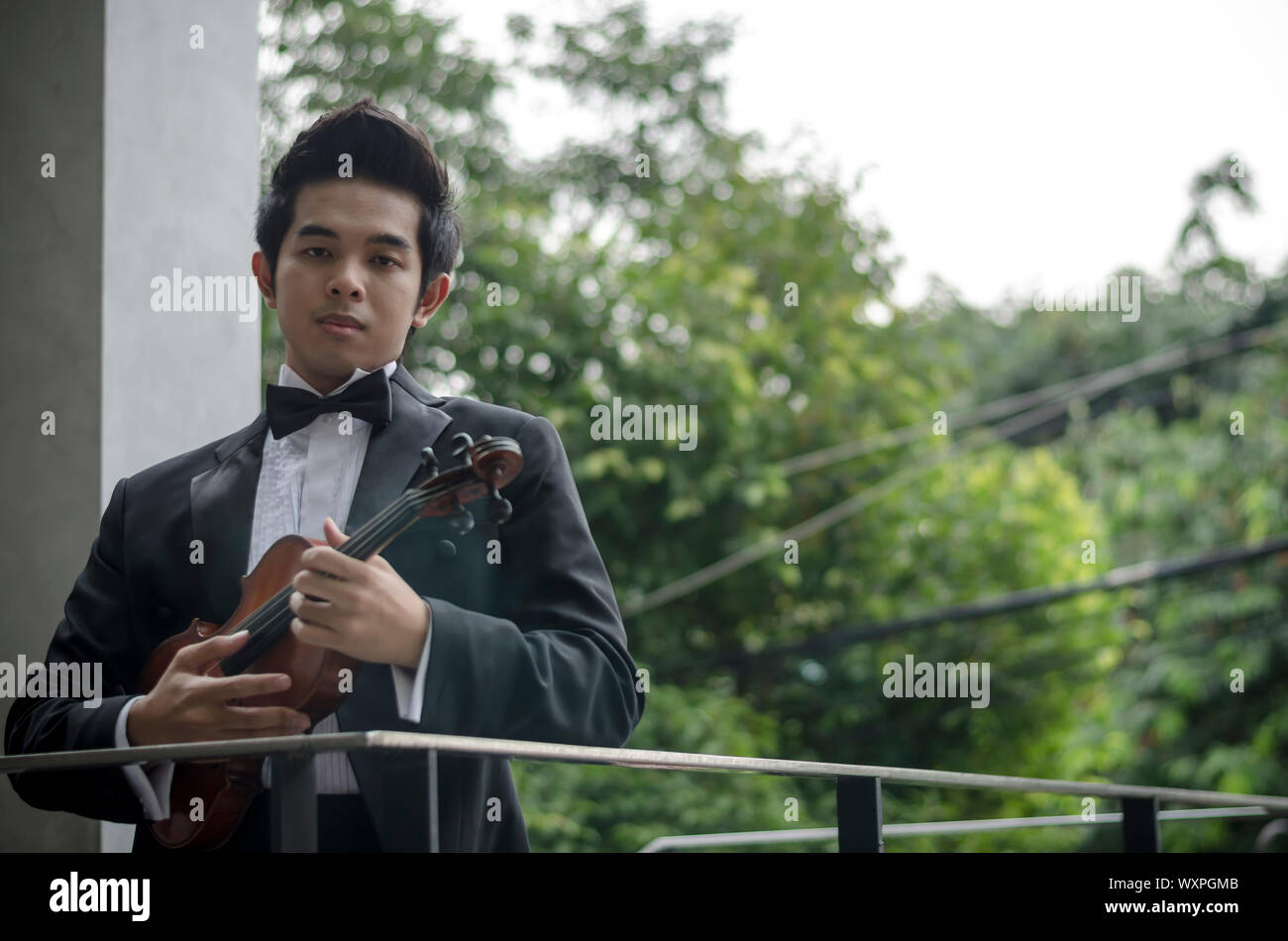 Thailand asia man with his violin he is a soloist Stock Photo - Alamy