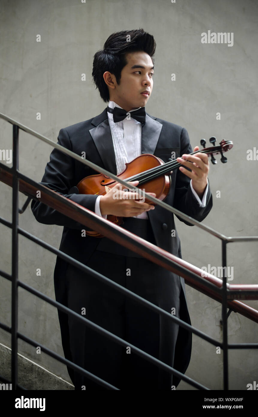 Thailand asia man with his violin he is a soloist Stock Photo - Alamy