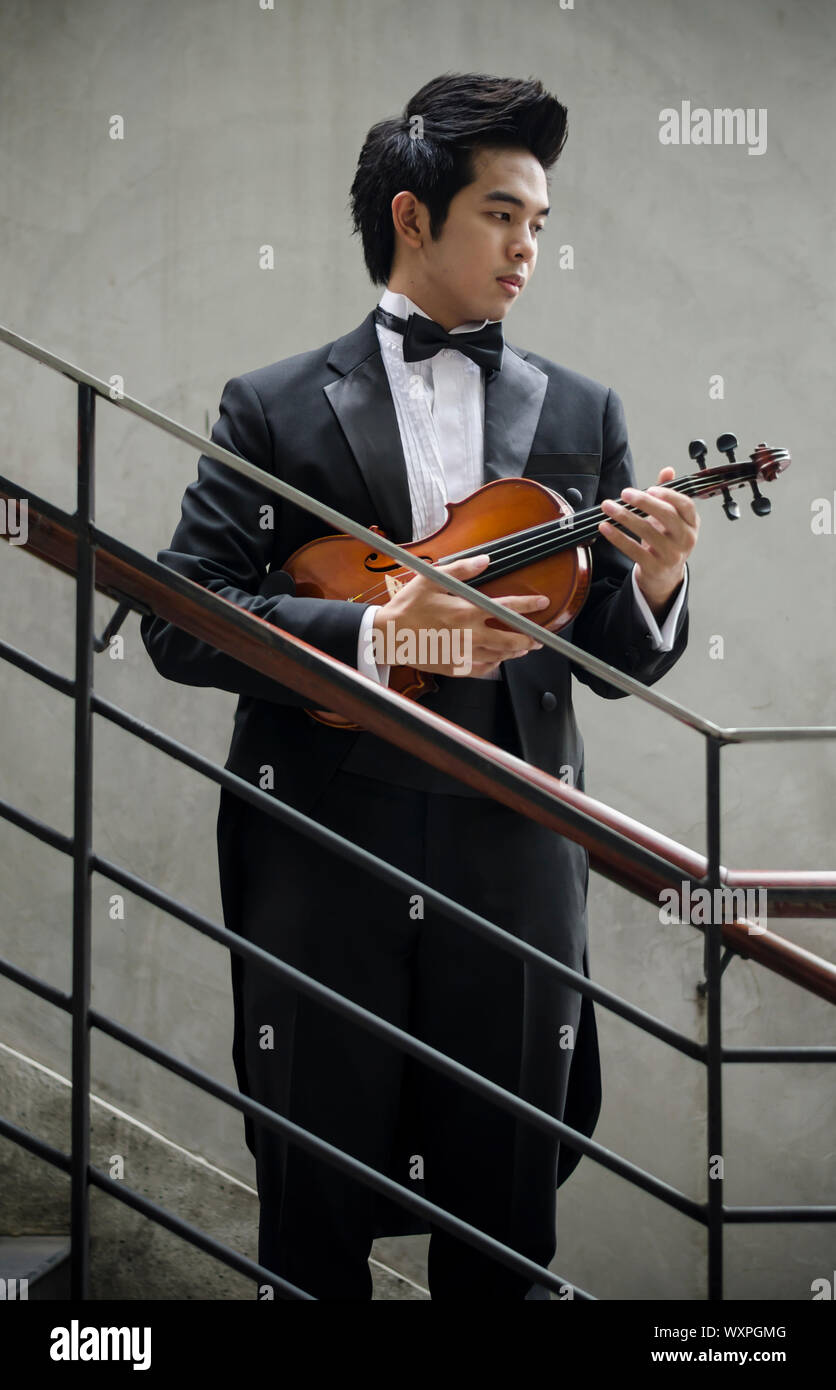 Thailand asia man with his violin he is a soloist Stock Photo - Alamy