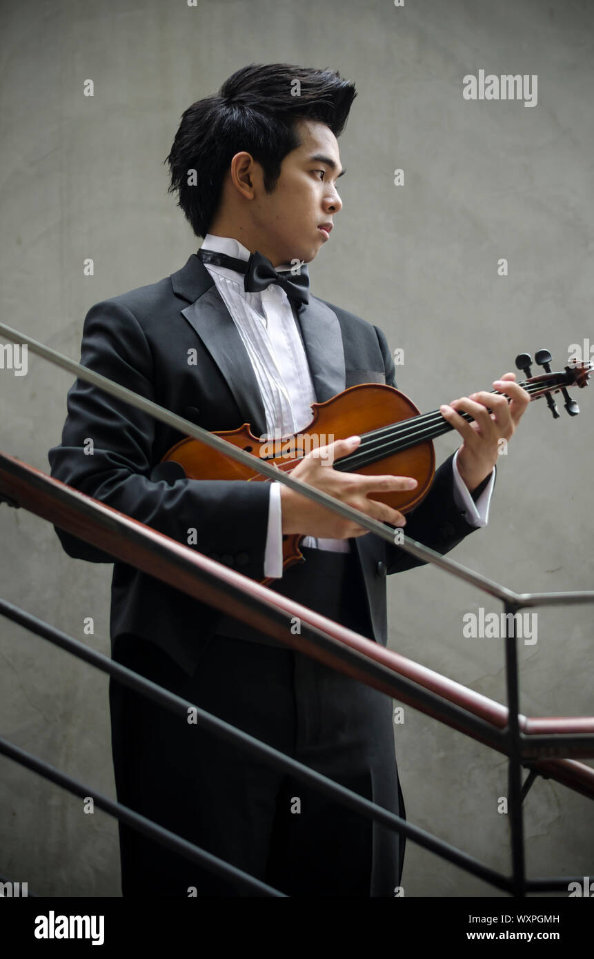 Thailand asia man with his violin he is a soloist Stock Photo - Alamy