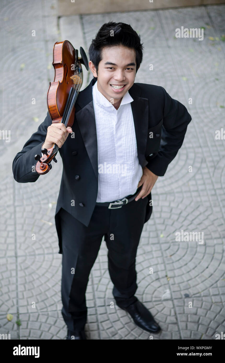 Thailand asia man with his violin he is a soloist Stock Photo - Alamy