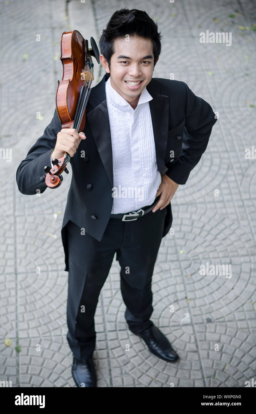 Thailand asia man with his violin he is a soloist Stock Photo - Alamy