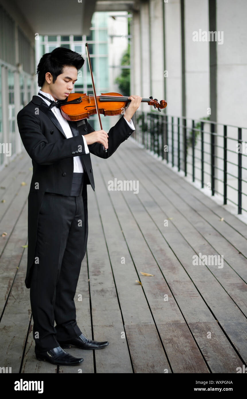 Thailand asia man with his violin he is a soloist Stock Photo - Alamy