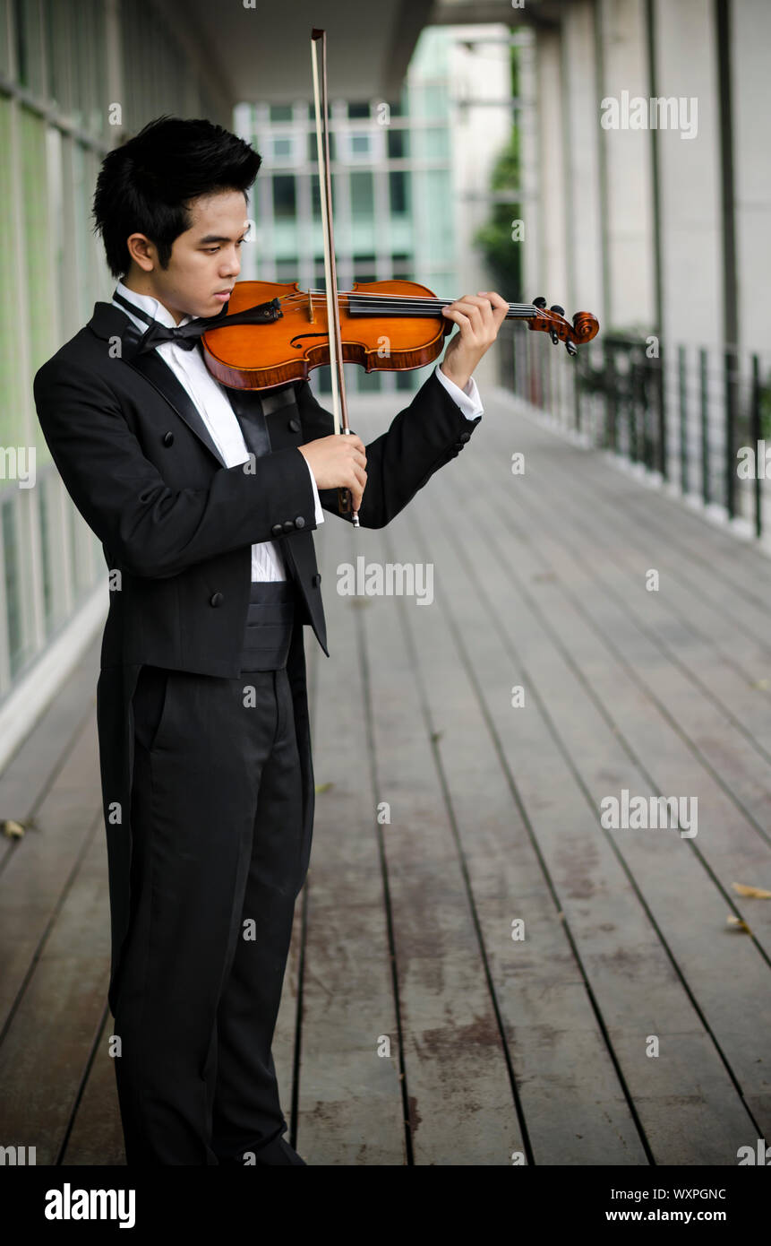 Thailand asia man with his violin he is a soloist Stock Photo - Alamy
